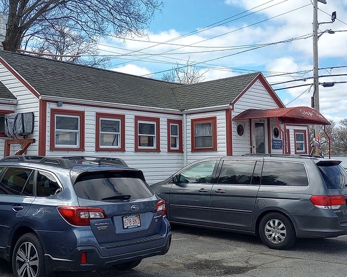 The white clapboard exterior with cheery red trim says "classic American diner" before you even step through the door.