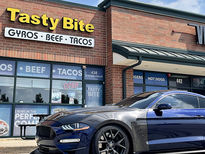 The bright yellow signage of Tasty Bite stands out like a culinary lighthouse, beckoning hungry travelers with promises of gyros, beef, and tacos that actually deliver.