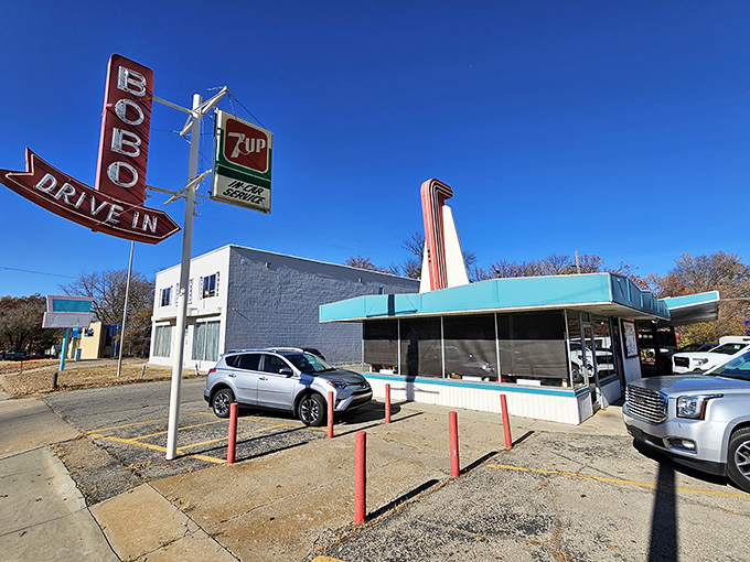 The iconic Bobo's sign stands tall against the Kansas sky, a neon beacon that's been guiding hungry travelers to burger bliss for generations.