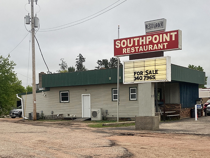 The iconic Southpoint Restaurant sign stands as a beacon of breakfast hope along the roadside, promising comfort food salvation to hungry travelers.