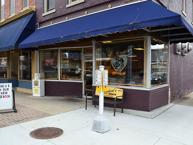 Beneath that iconic blue awning, Larrison's Diner waits quietly to transform your ordinary morning into breakfast magic worth remembering.
