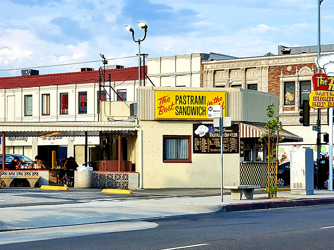 The bright yellow sign declares &ldquo;The Best Pastrami in the World,&rdquo; a bold claim this legendary spot has been backing up since 1951.