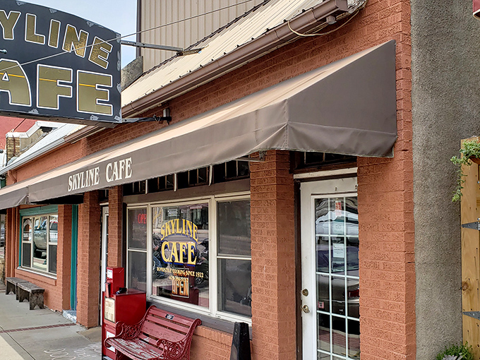 The brick facade of Skyline Caf&eacute; stands as a beacon of breakfast hope on Mena's main street, promising comfort food and conversations.