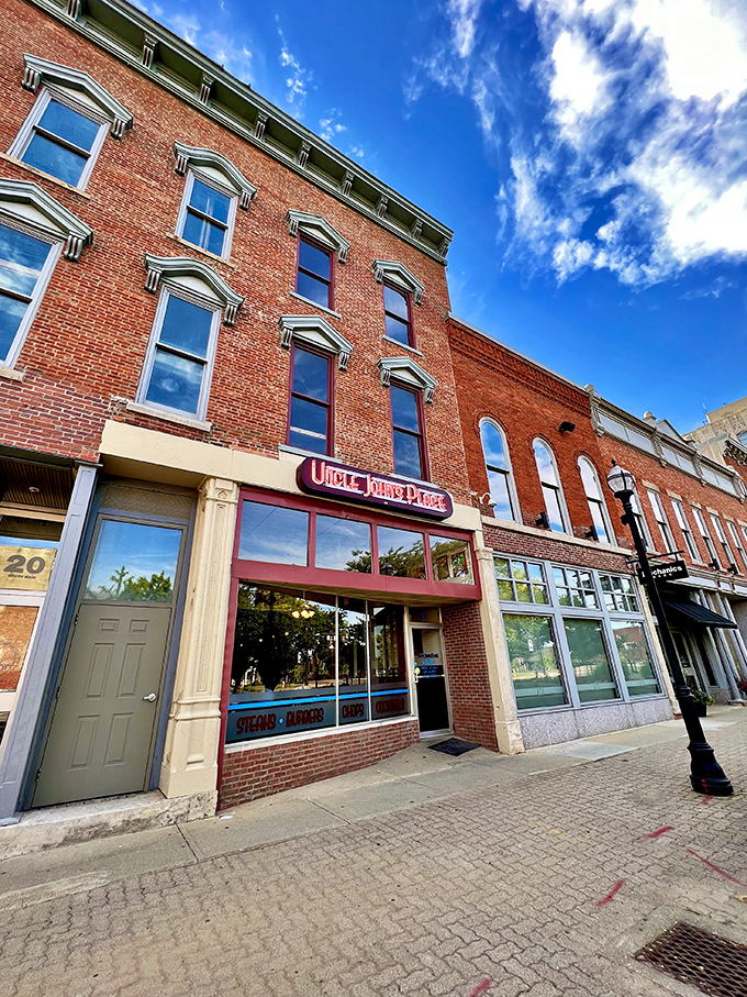 Uncle John's Place stands proudly on Mansfield's historic streetscape, its brick facade and vintage sign promising culinary treasures within.