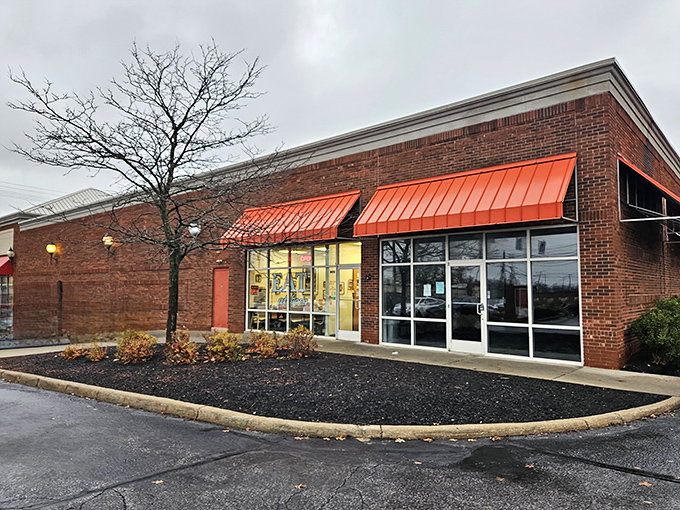 That iconic red awning against brick is like a beacon for hungry souls. Simple, unpretentious, and promising delicious comfort inside.
