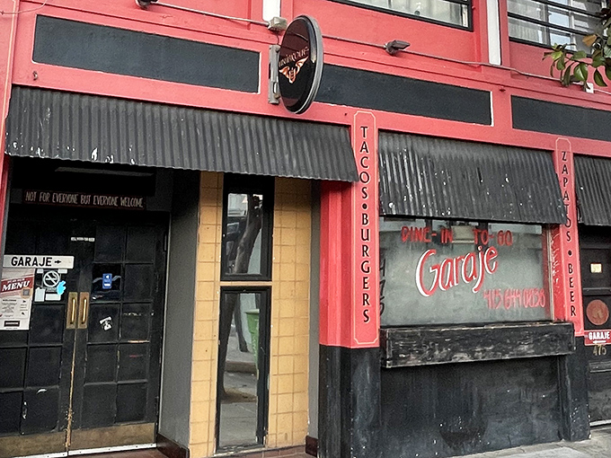 The pink fa&ccedil;ade of Garaje beckons like a neon-lit promise of deliciousness. That "TACOS&bull;BURGERS" sign isn't just advertising&mdash;it's a mission statement.