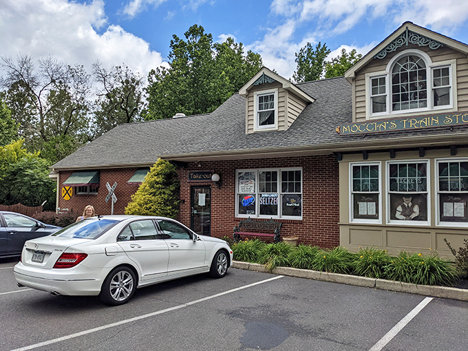 Moccia's Train Stop welcomes hungry travelers with its charming brick and tan exterior, where culinary adventures await just beyond those doors.