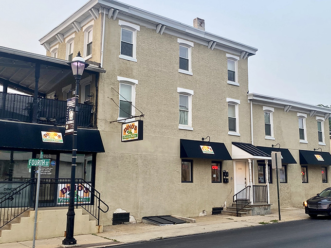 The unassuming exterior of Dino's Pizza & Pasta hides culinary treasures within. Like finding a Picasso at a yard sale, this Bridgeport gem rewards the curious.