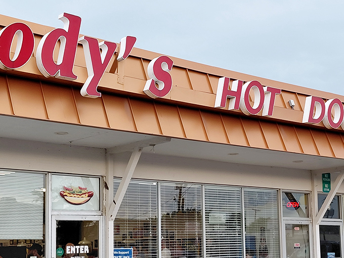 Jody's bold red signage against the copper-toned exterior isn't just a restaurant front&mdash;it's a beacon of hope for the hot dog deprived.