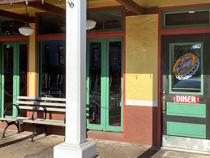 The cheerful yellow exterior of Ajax Diner beckons from Oxford Square like a Southern siren song, promising comfort food that'll make you weep with joy.