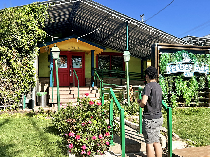 A colorful welcome awaits as flowering plants frame the path to pancake paradise.