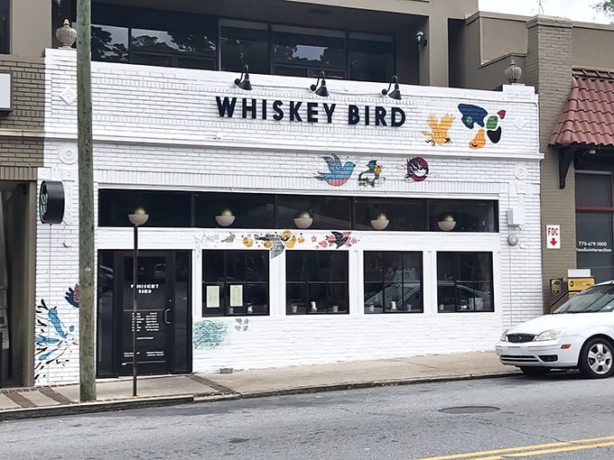 The colorful bird murals adorning Whiskey Bird's white brick fa&ccedil;ade aren't just decoration&mdash;they're a promise of the vibrant flavors waiting inside this Atlanta gem.