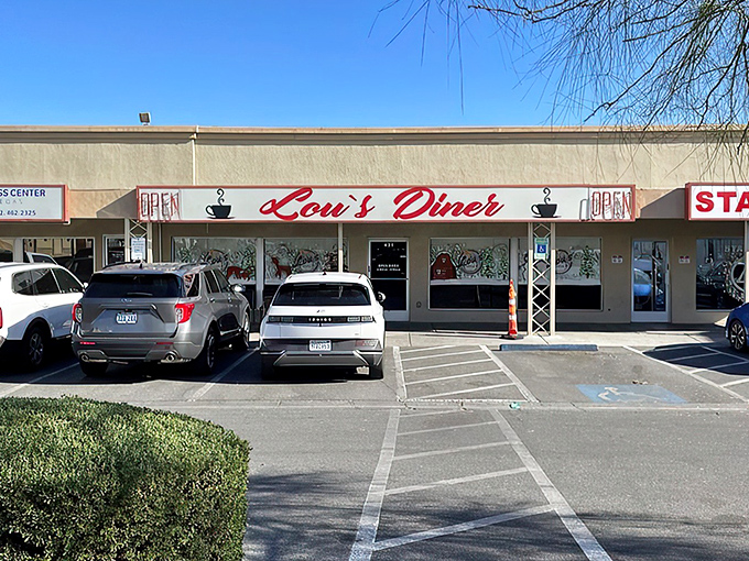 The unassuming storefront where breakfast dreams come true. Lou's red signage promises simple pleasures in a city known for excess.