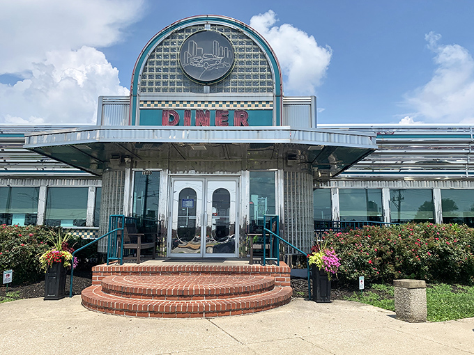 The gleaming chrome and teal facade of Boulevard Diner stands like a time machine to the golden age of roadside dining, beckoning hungry travelers with nostalgic charm.