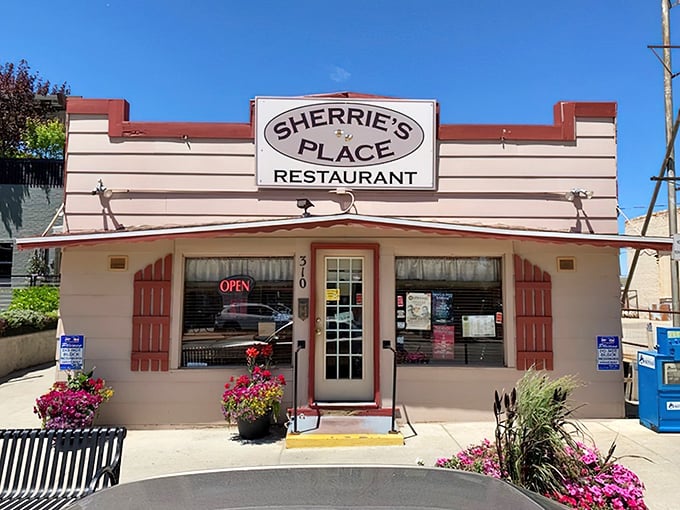 Summer flowers welcome visitors to this local institution, where the neon "OPEN" sign might as well read "Come home." No filter needed.