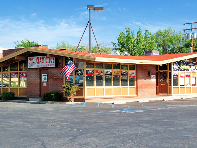 The classic brick exterior of Crazy Otto's Diner stands like a beacon of hope for hungry travelers. That American flag isn't just decoration&mdash;it's a promise of authentic diner goodness.