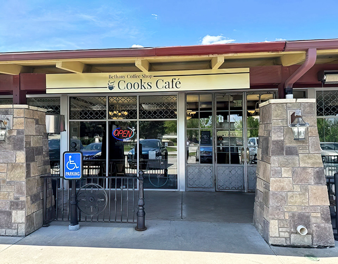 The stone pillars and welcoming entrance of Cook's Café stand like sentinels guarding a breakfast paradise that Lincoln locals have treasured for years.