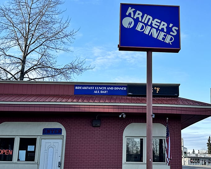 The iconic blue sign beckons hungry travelers like a lighthouse for the breakfast-obsessed. Promises of all-day breakfast never looked so inviting.