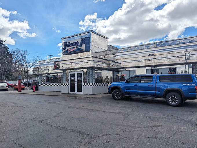 The gleaming chrome exterior of Johnny J's stands like a time machine in Casper, beckoning hungry travelers with its classic checkered facade.