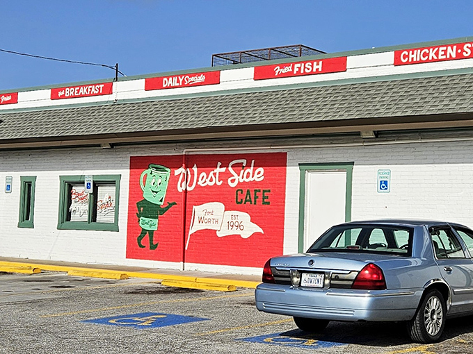 The cheerful cartoon mascot on West Side Cafe's exterior wall welcomes diners with a friendly wave, promising "Country Cookin'" that grandma would approve of.