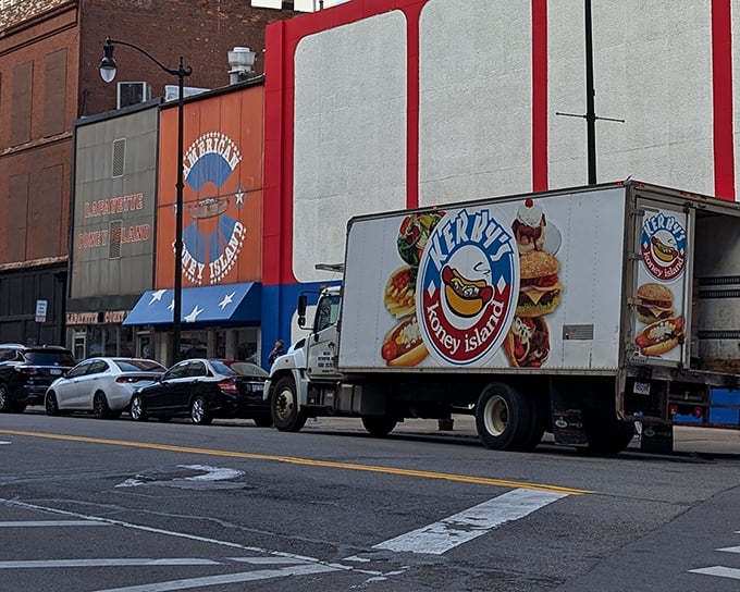 The iconic red, white, and blue exterior of American Coney Island stands proudly in downtown Detroit, a patriotic beacon for hungry hot dog pilgrims.