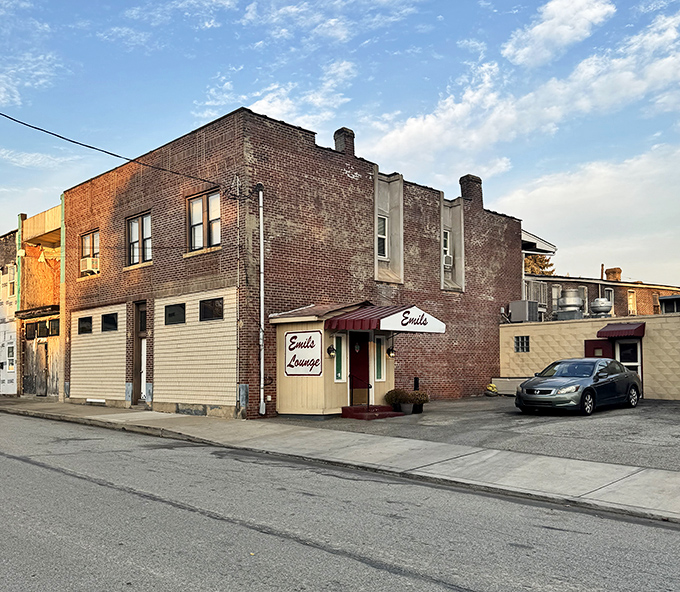 The unassuming brick exterior of Emil's Lounge stands like a sandwich sanctuary in Rankin, promising culinary treasures within its humble walls.