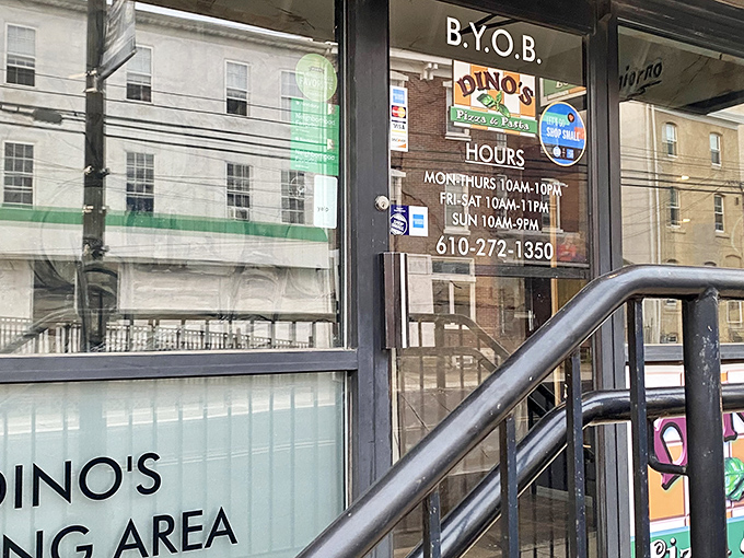 A classic Pennsylvania storefront that whispers rather than shouts. The yellow building with black awnings stands like a sentinel guarding delicious secrets.
