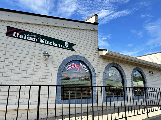 The unassuming white brick exterior of Jimmy's Italian Kitchen proves once again that culinary treasures often hide in plain sight.