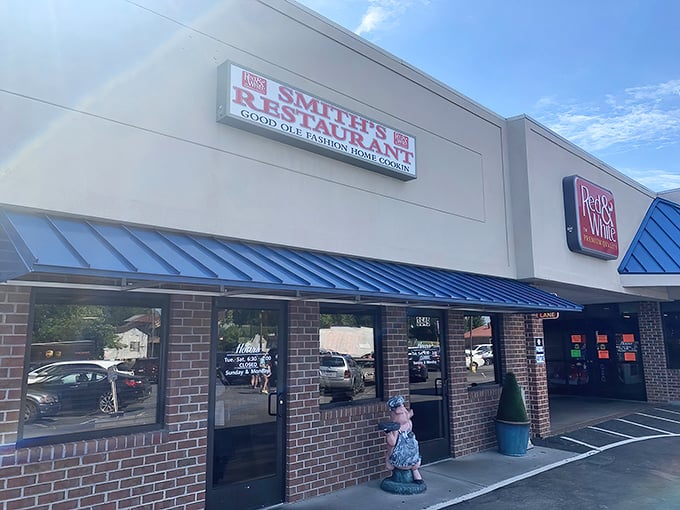 The unassuming exterior of Smith's Restaurant hides culinary treasures within. That blue awning might as well be a beacon for biscuit lovers everywhere.