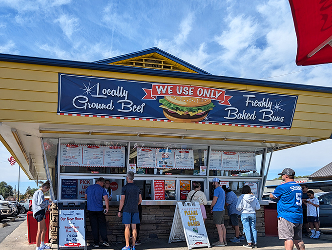 The bright yellow facade of Burger Bar stands like a beacon of hope for hungry travelers. No fancy frills, just the promise of burger perfection.