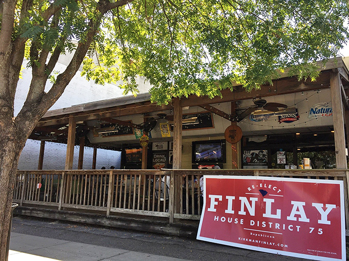 Shaded by trees and strung with twinkling lights, the outdoor seating area feels like your favorite beach vacation, minus the sand in your shoes.