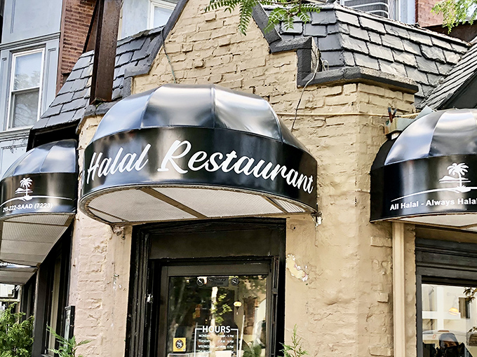 Nestled in a charming stone building with distinctive black awnings, Saad's Halal Restaurant stands as University City's unassuming culinary landmark.