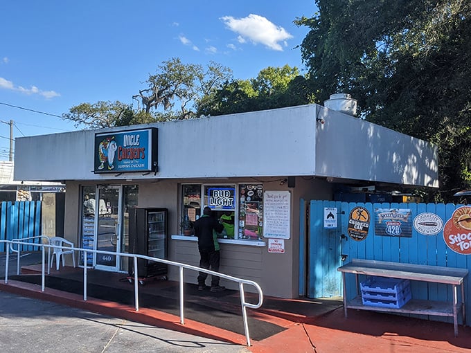 The bright blue fence at Uncle Chicken's isn't just eye-catching&mdash;it's nature's way of saying "extraordinary food happens here." No fancy frills, just flavor paradise waiting.