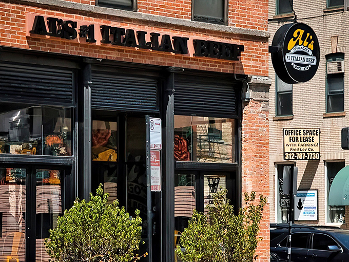 The iconic brick facade of Al's #1 Italian Beef on Wells Street stands as a beacon to sandwich seekers throughout Chicago's bustling downtown.