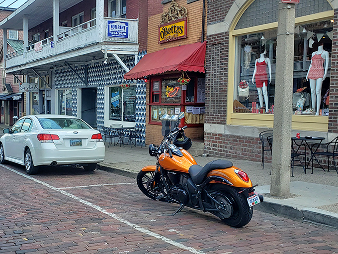 The charming brick storefront of O'Betty's beckons hungry visitors on Athens' historic street. That orange motorcycle knows where the good stuff is!