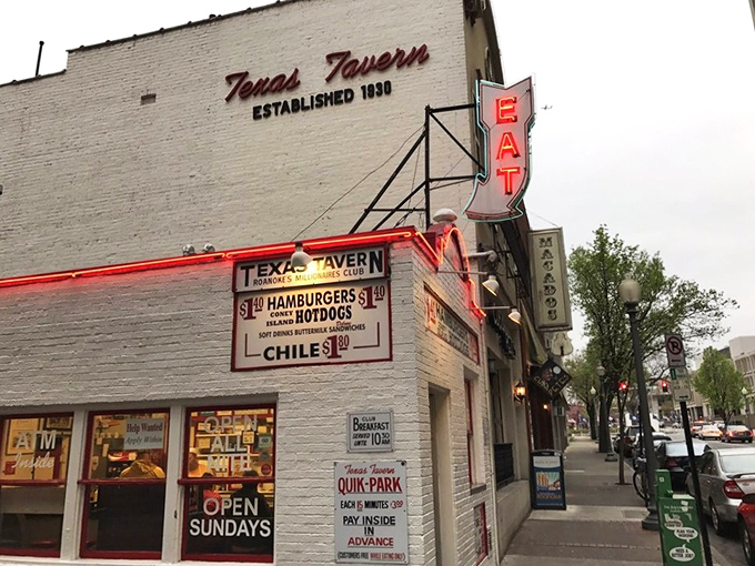 The iconic white brick facade of Texas Tavern stands like a culinary lighthouse in downtown Roanoke, beckoning hungry travelers with its vintage neon glow.
