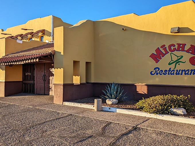 The sunshine-yellow exterior of Micha's stands like a beacon of culinary promise against Tucson's blue sky, its terra cotta roof tiles practically whispering "authentic Mexican food ahead."