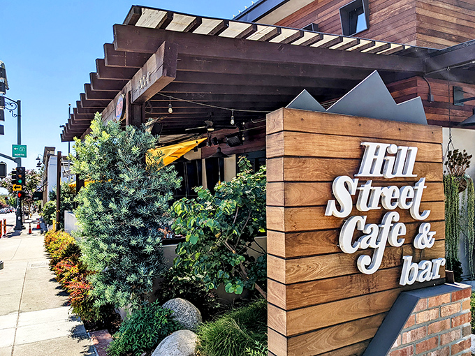 A modern rustic welcome awaits with the wooden sign announcing your arrival at Hill Street Cafe & Bar&mdash;where comfort food gets its California upgrade.