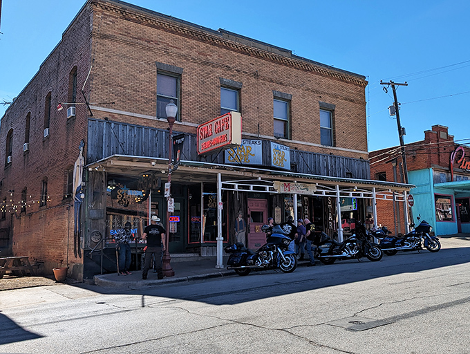 History stands tall in brick and mortar at Star Cafe, where motorcycles line up like eager diners waiting for their turn at Texas comfort food greatness.