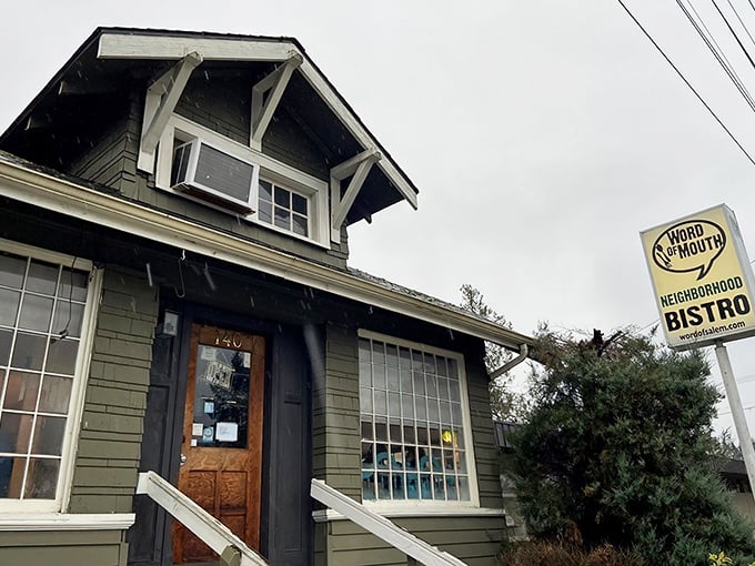 A second view of this charming craftsman-style home turned restaurant. The flowering bushes seem to be celebrating what's cooking inside.