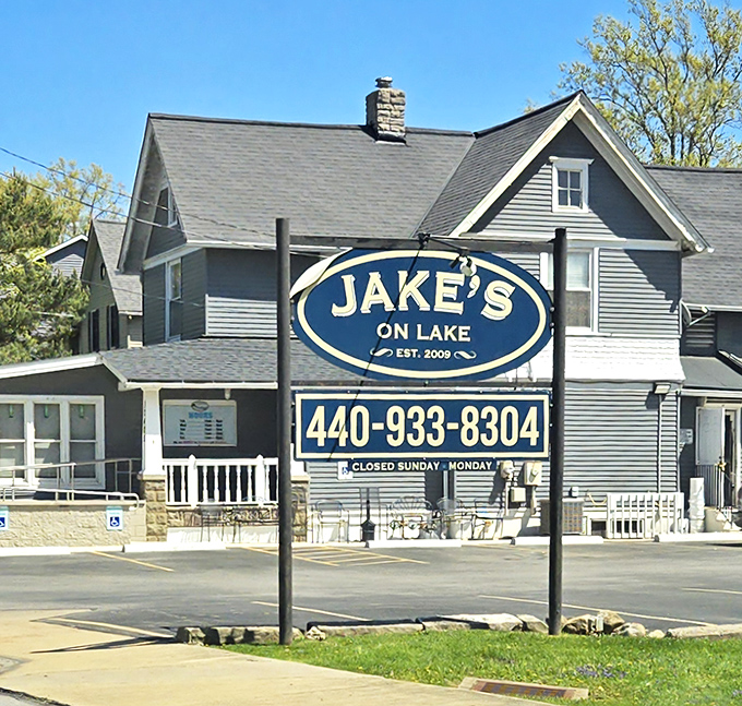 Jake's On Lake transforms into a welcoming beacon at dusk, its illuminated porch practically whispering "come hungry, leave happy" to passersby.