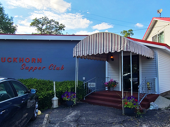 That striped awning has welcomed more happy diners than a church has seen Sunday dinners.