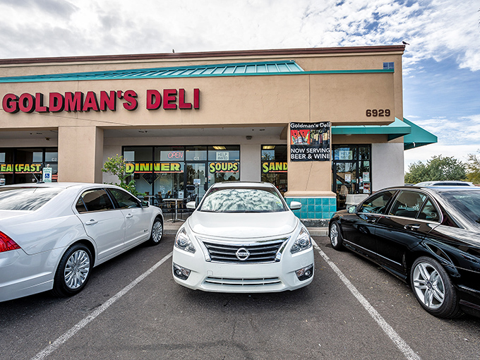 Goldman's bold red signage beckons like a lighthouse for the sandwich-starved, promising deli salvation in the Arizona desert.