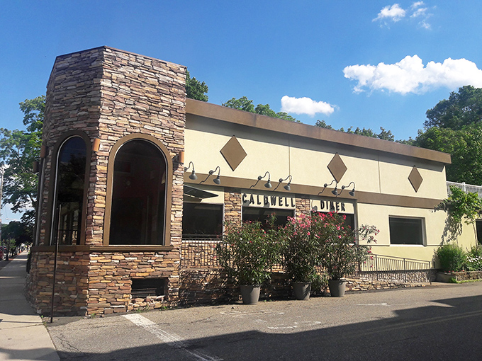 The stone facade of Caldwell Diner stands like a humble culinary fortress, promising comfort food treasures within its unassuming exterior.