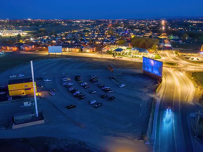 Twilight magic at the Terrace Drive-In, where cars gather like fireflies and Idaho's night sky becomes the ultimate ceiling for movie magic.