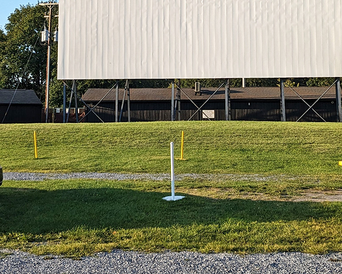 The massive white screen stands ready for twilight magic, a blank canvas awaiting Hollywood dreams under Pennsylvania stars.
