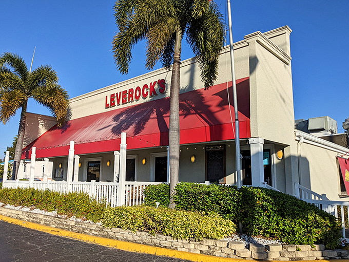 The iconic red awning of Leverock's stands out against the Florida sky like a beacon calling to hungry seafood lovers everywhere.