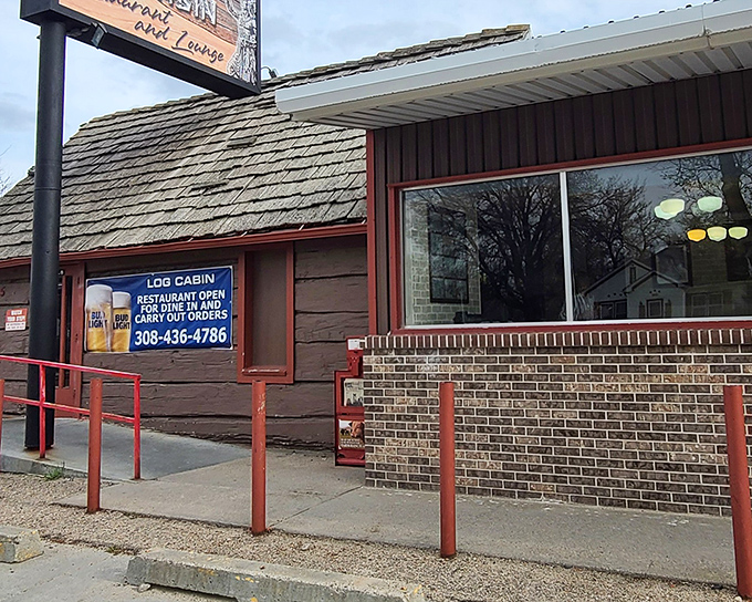 A closer look at this unassuming roadside treasure reveals the brick foundation and welcoming red railings of Nebraska's comfort food haven.