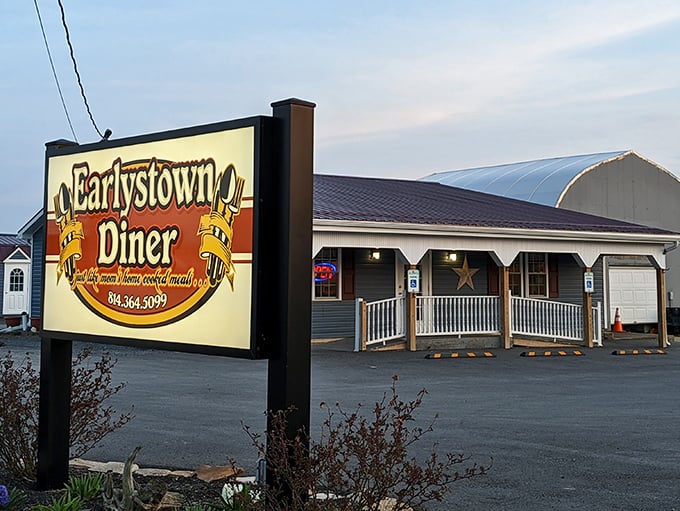 The classic roadside beacon that promises salvation for hungry travelers. Earlystown Diner's welcoming porch and illuminated sign have guided countless Pennsylvania appetites home.