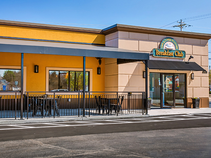 The sunshine-yellow exterior of The Breakfast Club isn't just cheerful&mdash;it's practically announcing "morning happiness served here!" Complete with cozy patio seating.